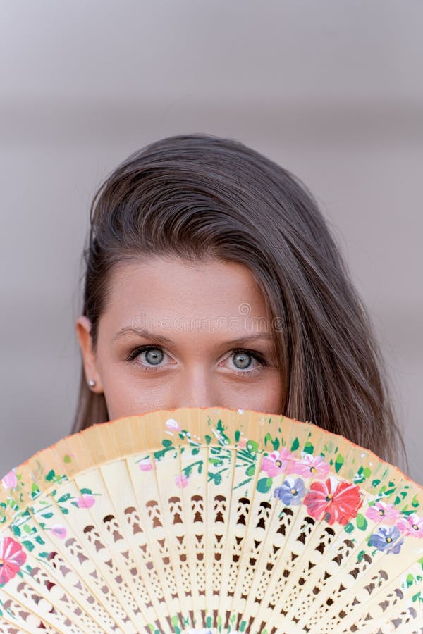 Woman Hiding Face Behind a Hand Fan. Stock Image - Image of covering ...