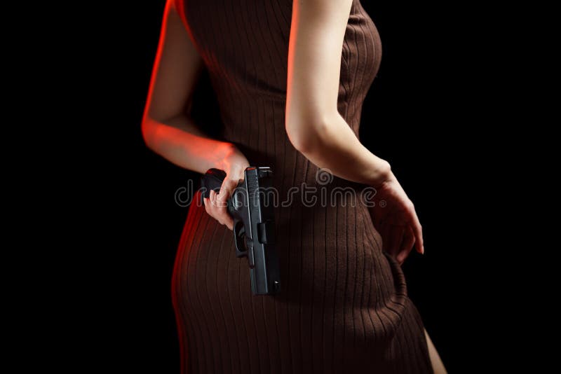 Woman Hiding Handgun Behind Her Back on Black Background Stock Image ...