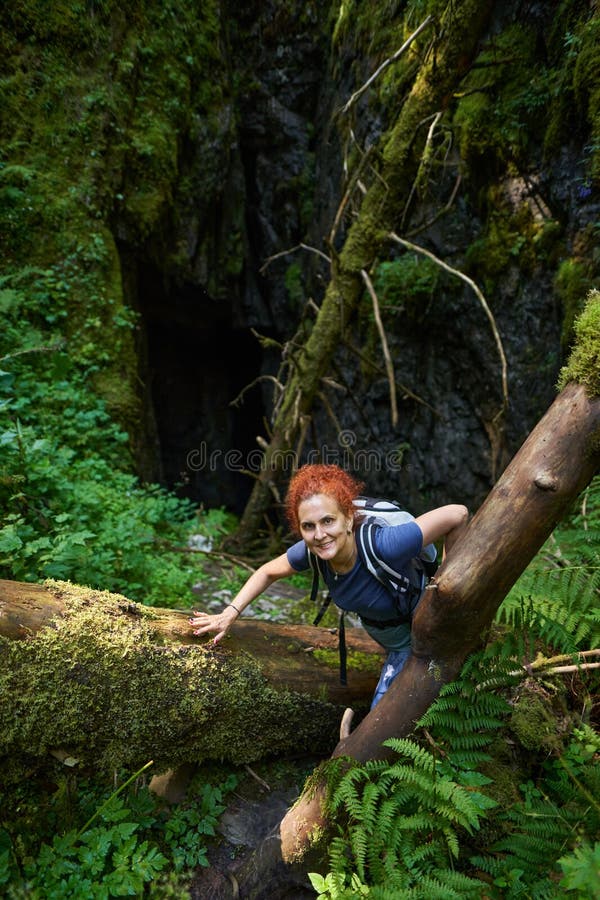 Woman exploring a cave stock image. Image of person - 290803369