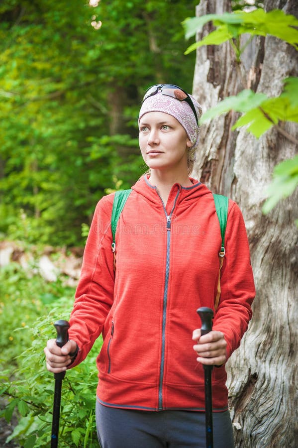 Woman Hiker in the Red Jacket with Sticks in Forest Outdoor Stock Image ... Woman Hiker in the Red Jacket with Sticks in Forest Outdoor Stock Image ...