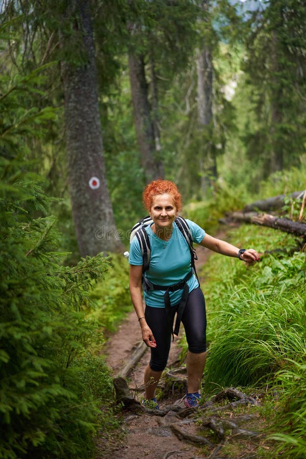 Woman Hiking on a Trail in the Mountains Stock Image - Image of tourist ...
