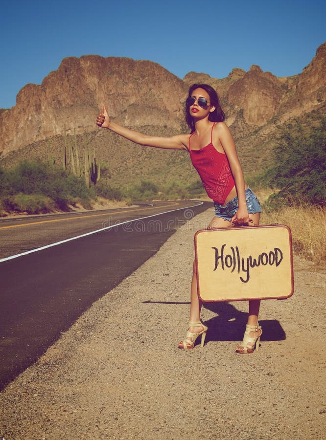 Woman hitching a ride stock photo. Image of beautiful - 19146132
