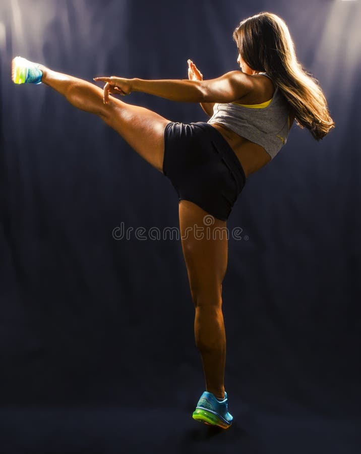 High Kick Dance by Happy Young Woman in Studio Stock Photo - Image of ...