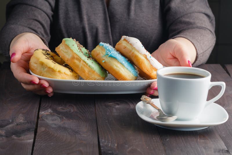 Woman Hold Plate with Donuts. Stock Photo - Image of fresh, nails: 67436944