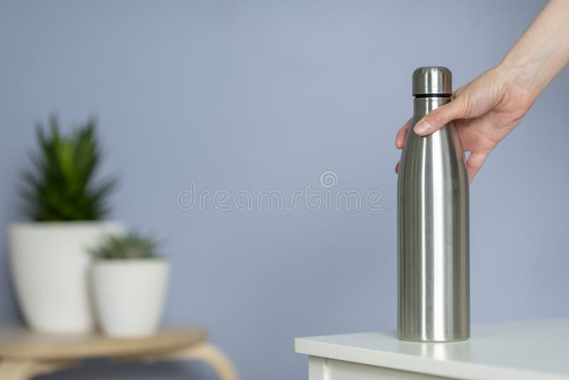 Woman Hold Steel Water Bottle on the Table at Home. Zero Waste Stock ...