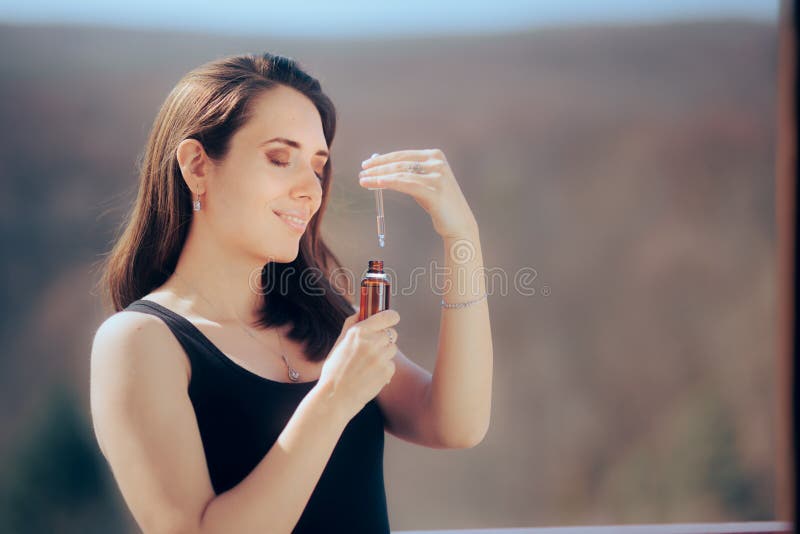 Woman Holding Anti-Aging Serum for Her Skin Routine Stock Photo - Image ...