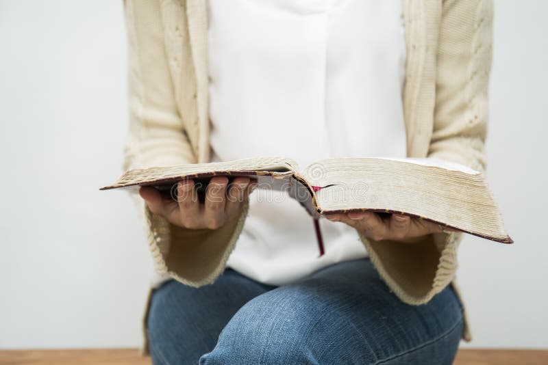 Woman holding bible stock image. Image of people, book - 117121635