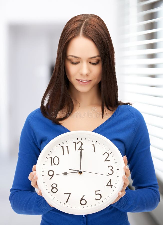 Woman holding big clock stock image. Image of looking - 38313369