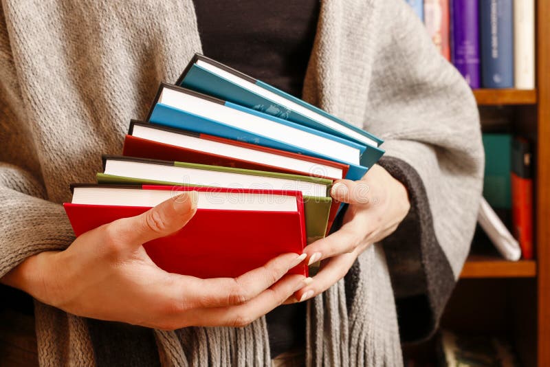 Woman holding books stock image. Image of library, notebook - 47681887