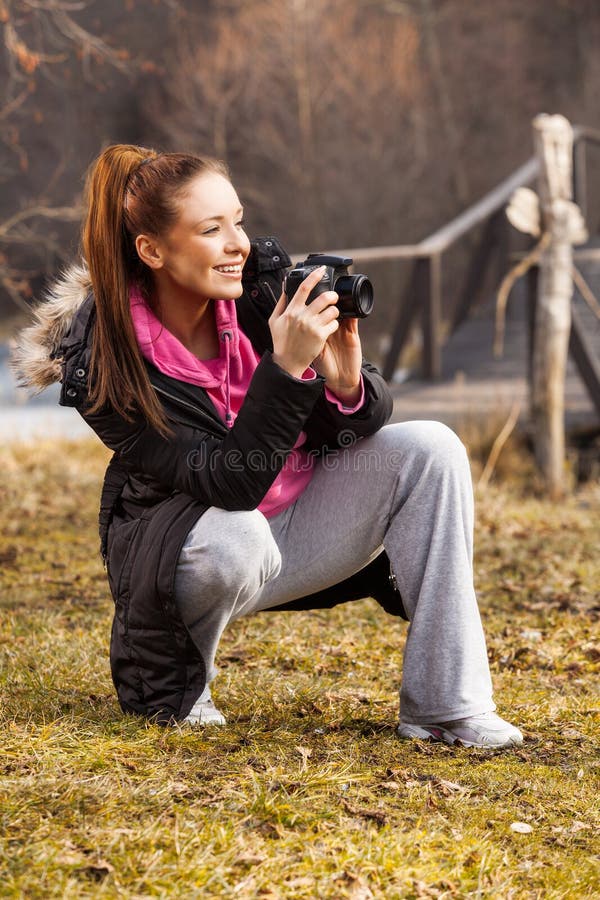 Woman Holding Camera and Taking Photo Outside Stock Image - Image of ...