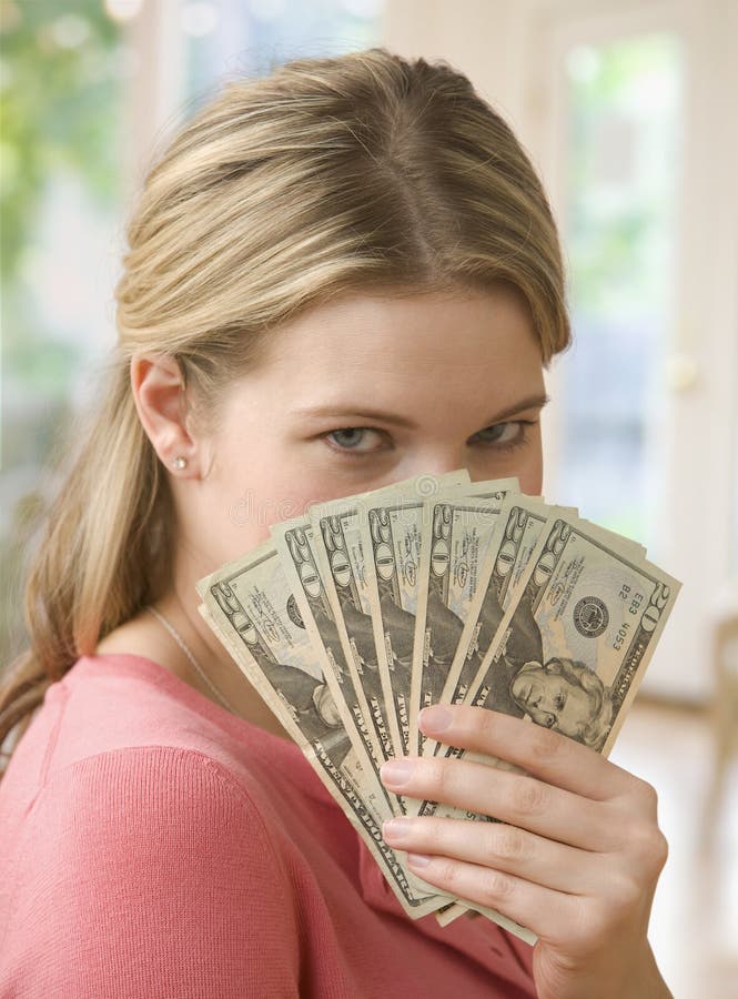 Woman Holding Cash stock image. Image of indoors, inside - 14647555