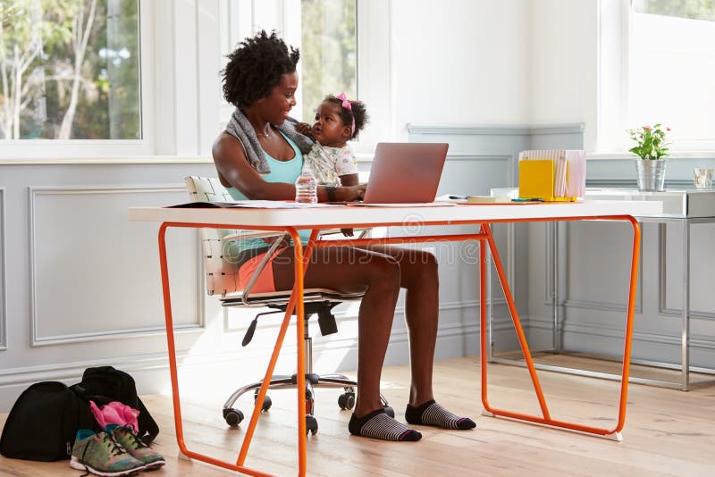 Woman Holding Child Using Computer at Home after Exercising Stock Image ...