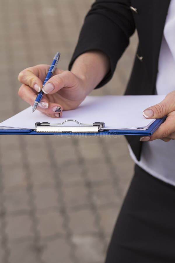 Woman holding a clip board stock photo. Image of recruiting - 69671538