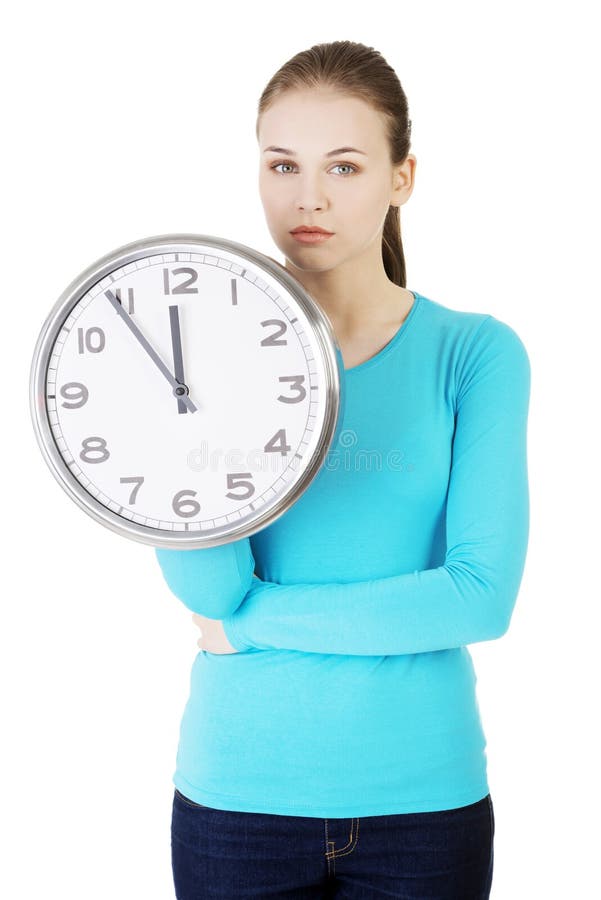 Woman holding a clock stock photo. Image of head, beautiful - 46308460