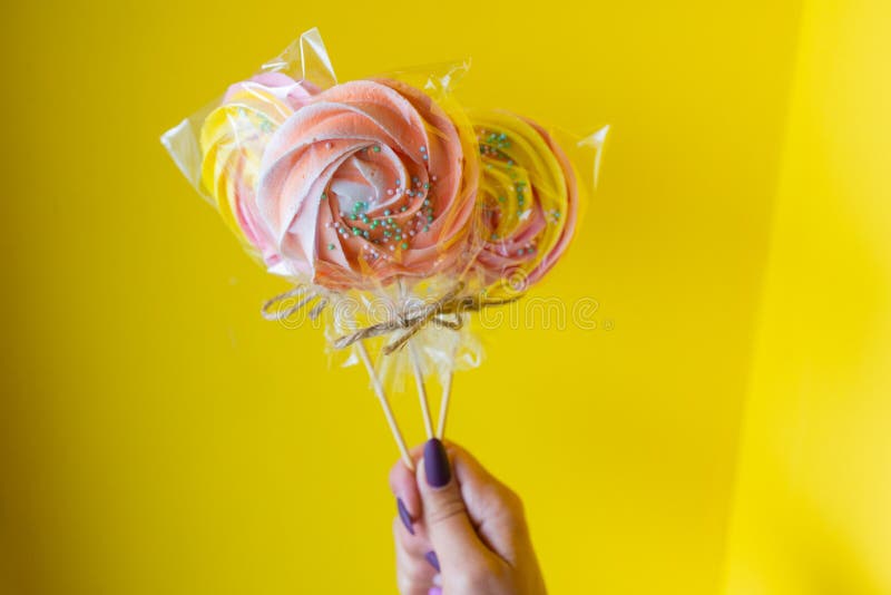 A Woman Holding a Colorful Candy in Hand. Stock Image - Image of sugar ...
