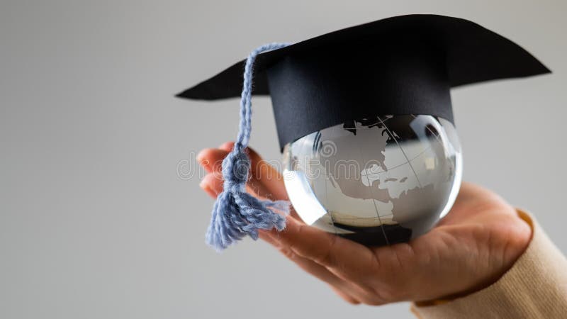 Woman Holding a Crystal Globe Wearing a Graduation Cap. Stock Photo ...