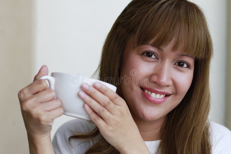 Woman Holding Cup stock image. Image of cafe, smiling - 21973509