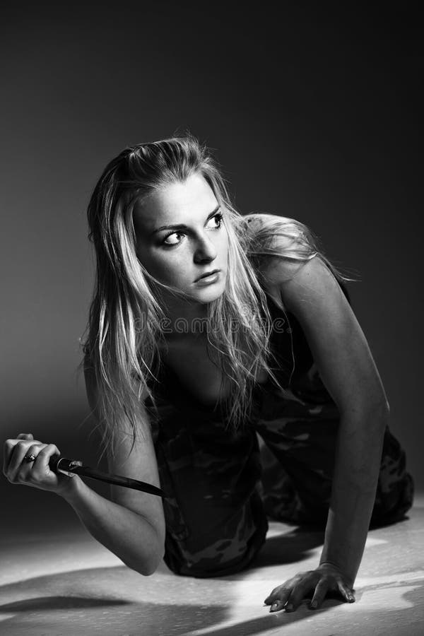 Woman holding dagger stock photo. Image of military, night - 23040634