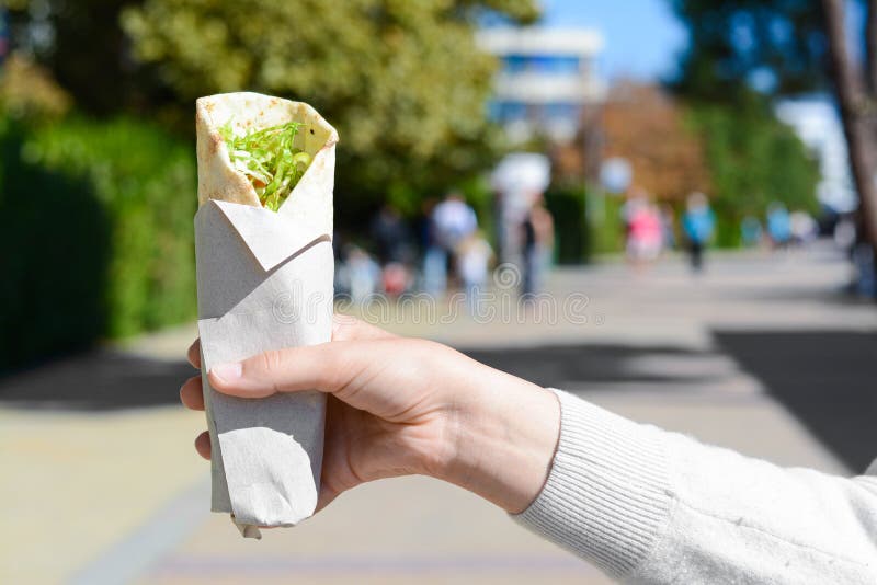 Woman Holding Delicious Vegetable Roll Outdoors, Closeup Stock Image ...