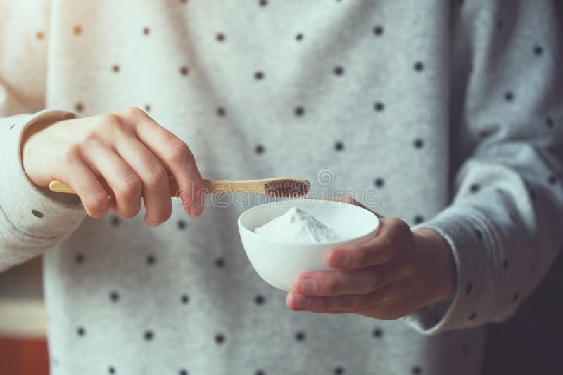 Woman Holding Eco-friendly Bamboo Toothbrush and Natural Toothpaste ... Woman Holding Eco-friendly Bamboo Toothbrush and Natural Toothpaste ...
