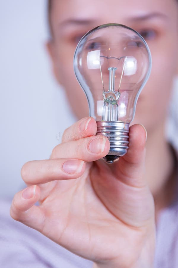 Person Holding Energy Saving Lamp Stock Photo - Image of illuminated ...