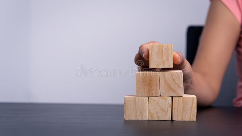 A Woman Holding an Empty Wooden Block on the Table Where she Can Write ...