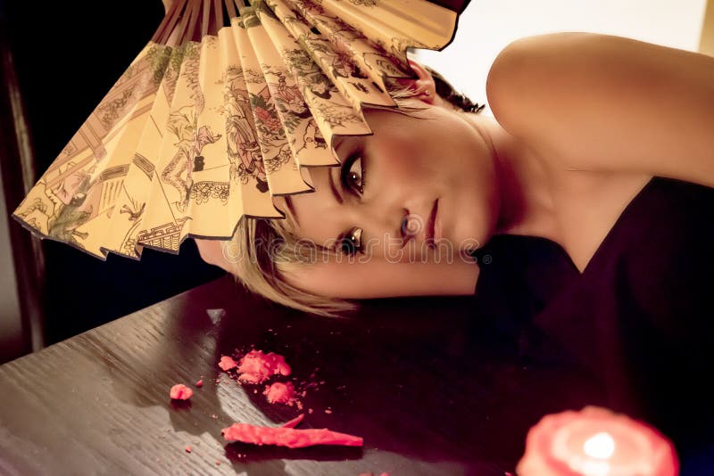 Mature Woman in Black Bikini and Red Hat Lying on Tropical Beach Stock ...