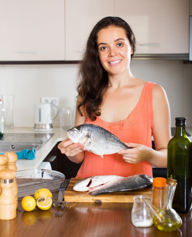 149 Happy Woman Cooking Saltwater Fish Stock Photos - Free & Royalty ...