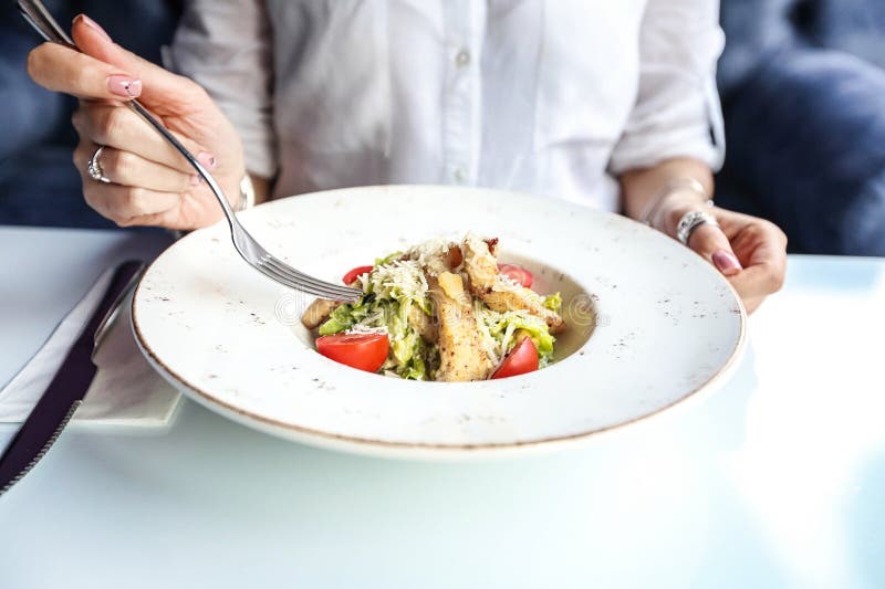 Woman Holding Fork and Plate of Food at Restaurant Table Stock Image ...