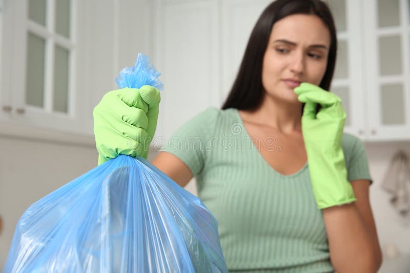 Woman Holding Full Garbage Bag at Home, Focus on Hand Stock Image ...