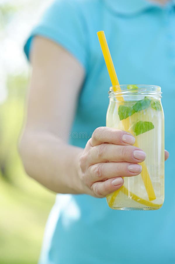 Woman Holding a Glass of Lemonade. Stock Image - Image of human, close ...
