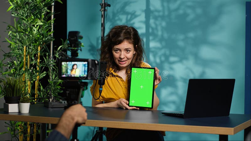 Woman Holding Green Screen Tablet, Talking about Specifications Stock ...