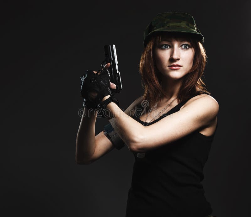 Woman holding gun stock image. Image of firearm, handgun - 23936701