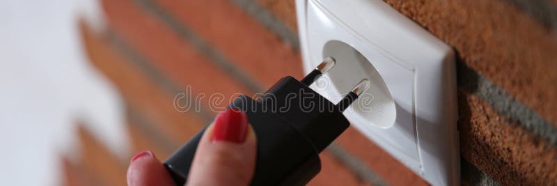 Woman Holding Hand and Inserting Plug into Socket Closeup Stock Image ...