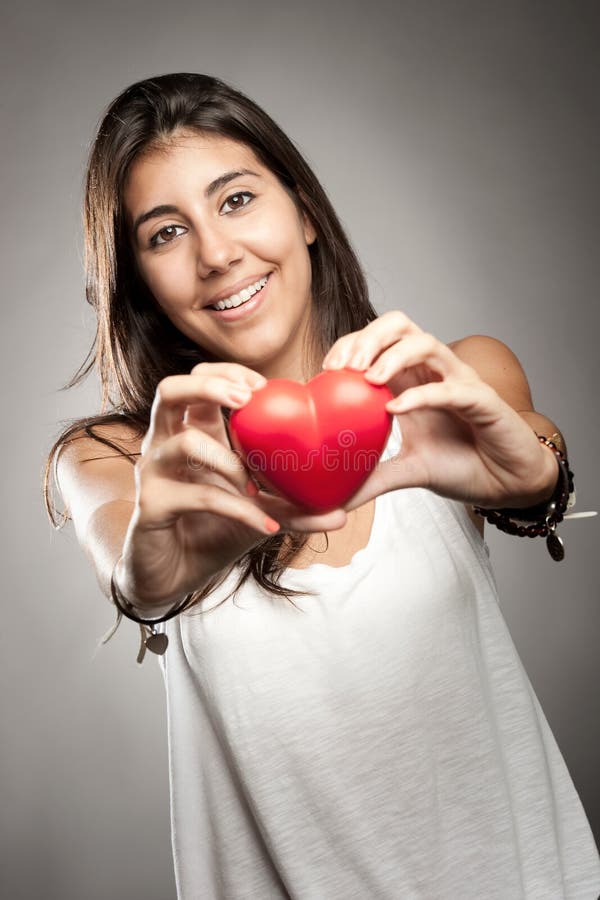 Woman holding a heart stock image. Image of laughter - 30444901