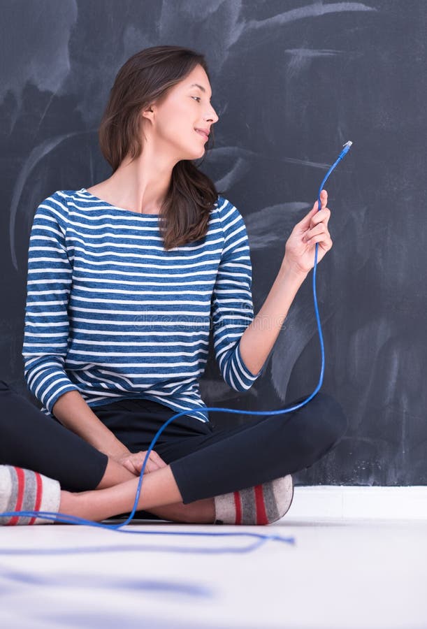 Woman Holding a Internet Cable in Front of Chalk Drawing Board Stock ...