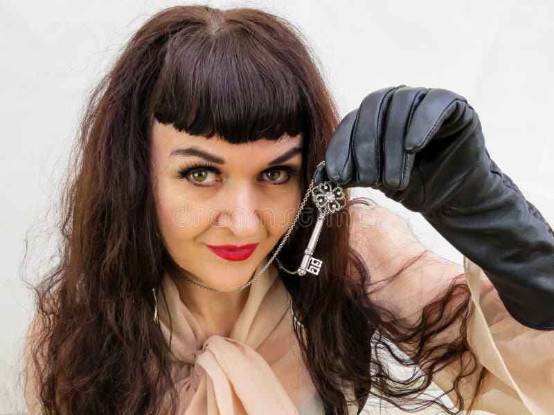 Woman Holding a Key with Gloved Hand. Stock Photo - Image of female ...