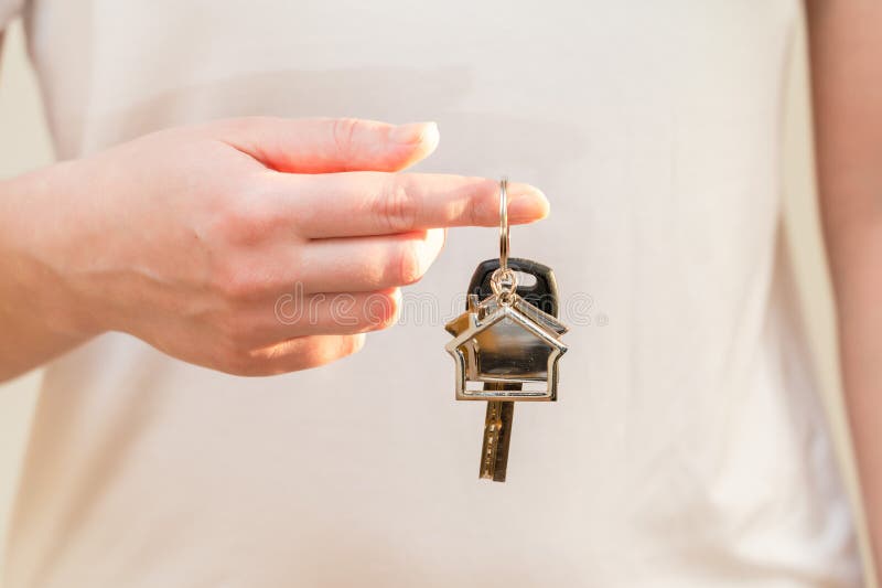 Woman Holding Key with Keychain in the Shape of the House Stock Image ...