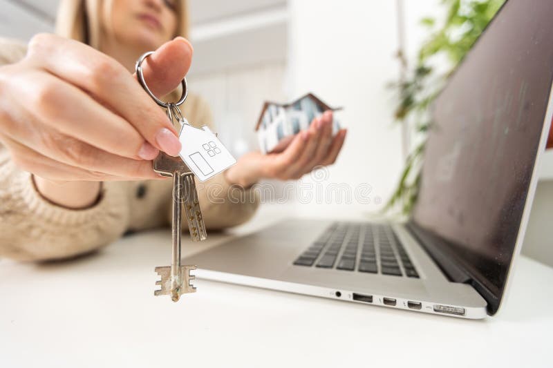 Woman Holding Keys with Laptop Stock Image - Image of finance, symbol ...
