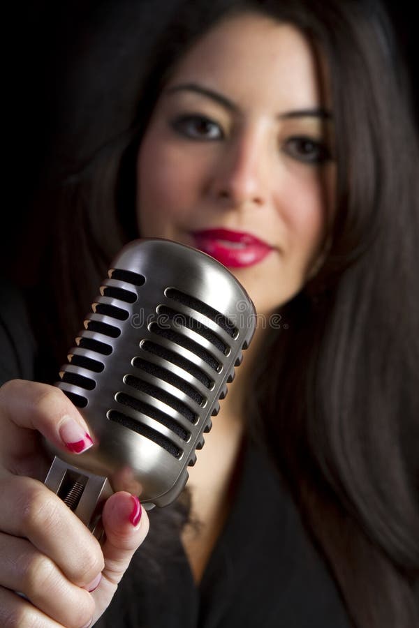7,300 Young Woman Holding Microphone Stock Photos - Free & Royalty-Free ...