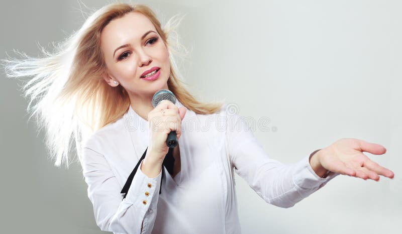 Woman holding microphone stock photo. Image of pretty - 89083176