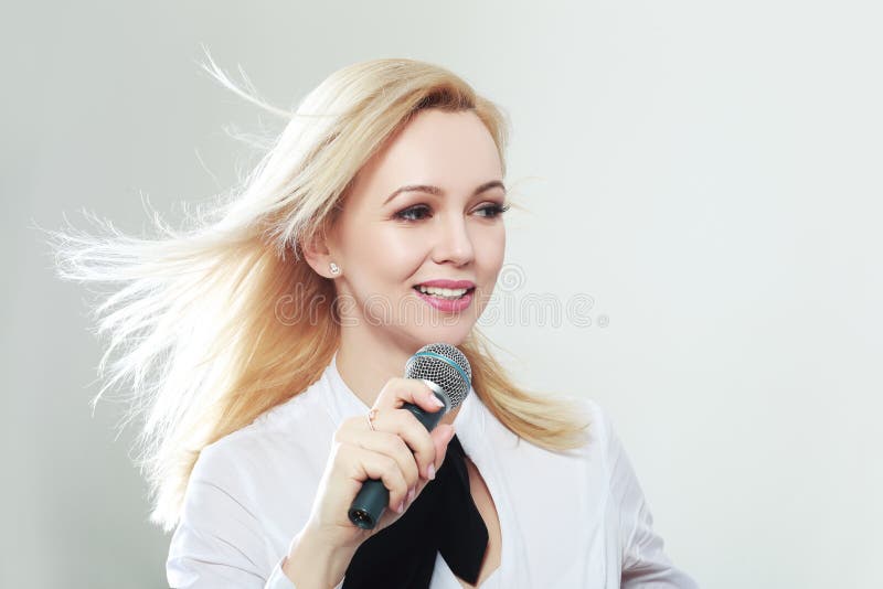 Woman holding microphone stock image. Image of journalist - 89083343