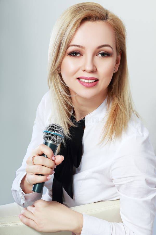 Woman holding microphone stock photo. Image of color - 91303894
