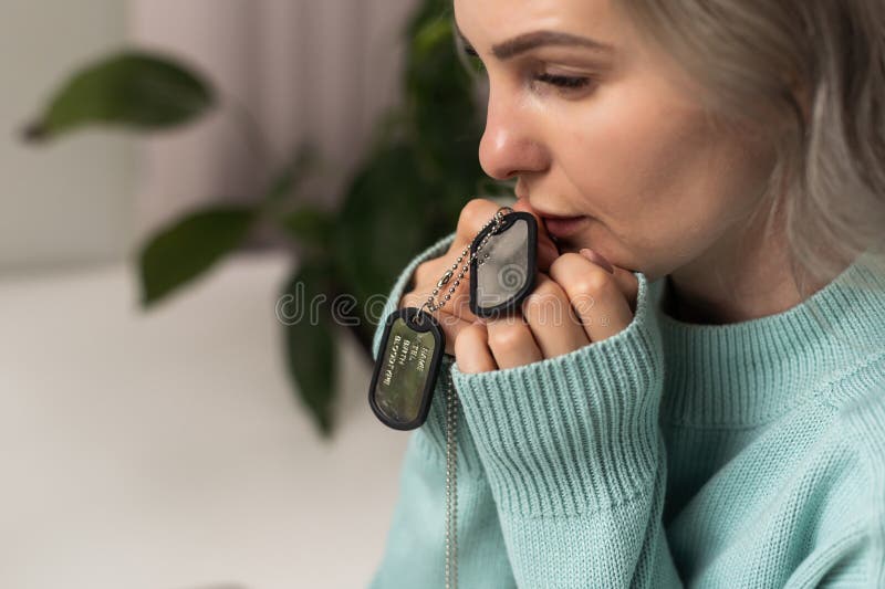 Woman Holding Military Token in Hand Stock Photo - Image of badge, hard ...