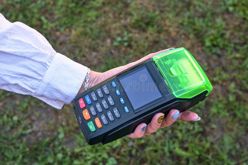 A Woman is Holding a Payment Terminal in Her Hand Stock Image - Image ...