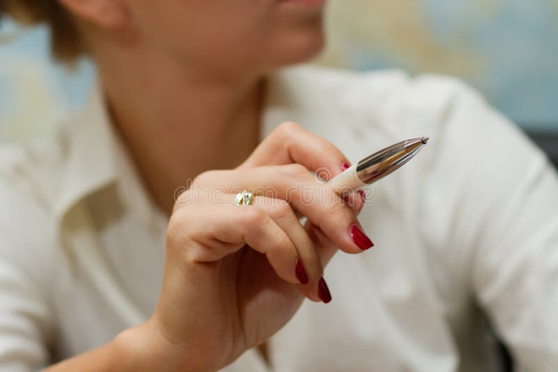 Woman holding a pen stock photo. Image of single, focus - 27402368