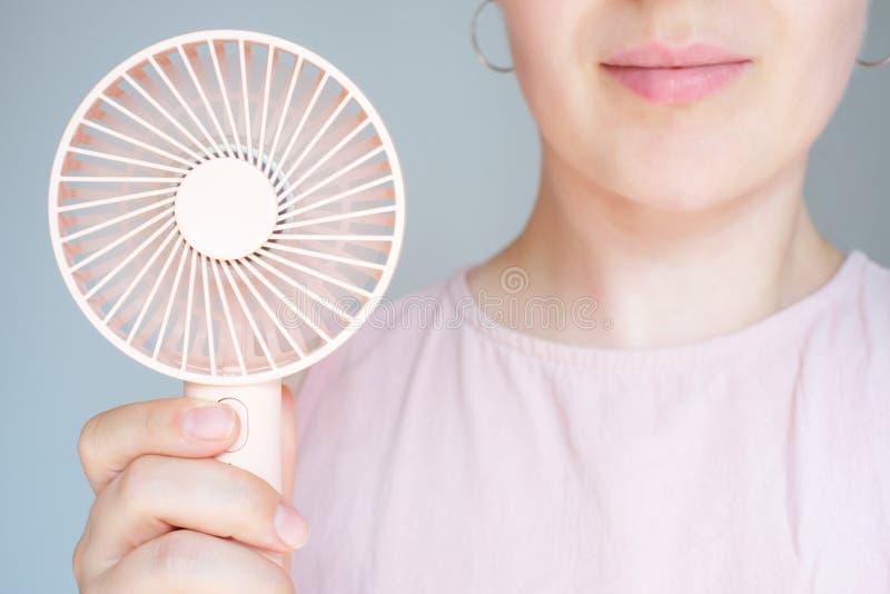 Woman Holding Pink Mini Fan Close Up Front View. Stock Image - Image of ...