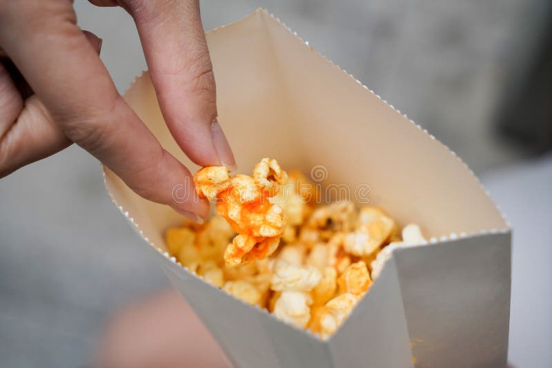 Woman Holding Popcorn Cheese in a Paper Bag in Hand Stock Photo - Image ...