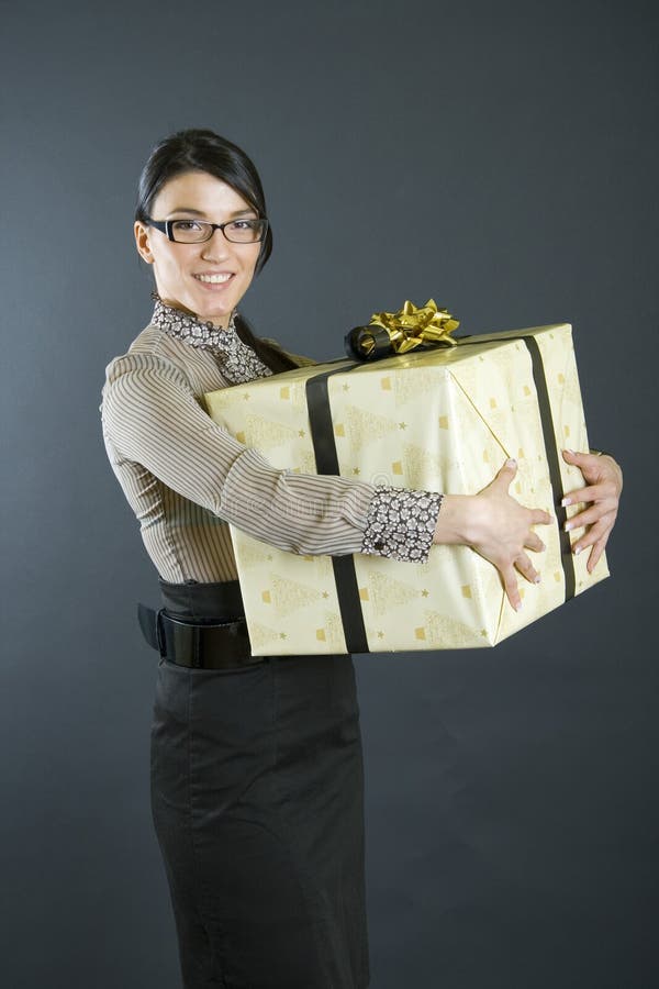 Woman holding a present stock image. Image of model, brunette - 7508171