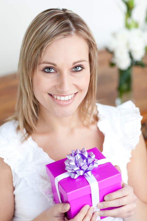 Woman Holding a Present Sitting on the Floor Stock Image - Image of ...